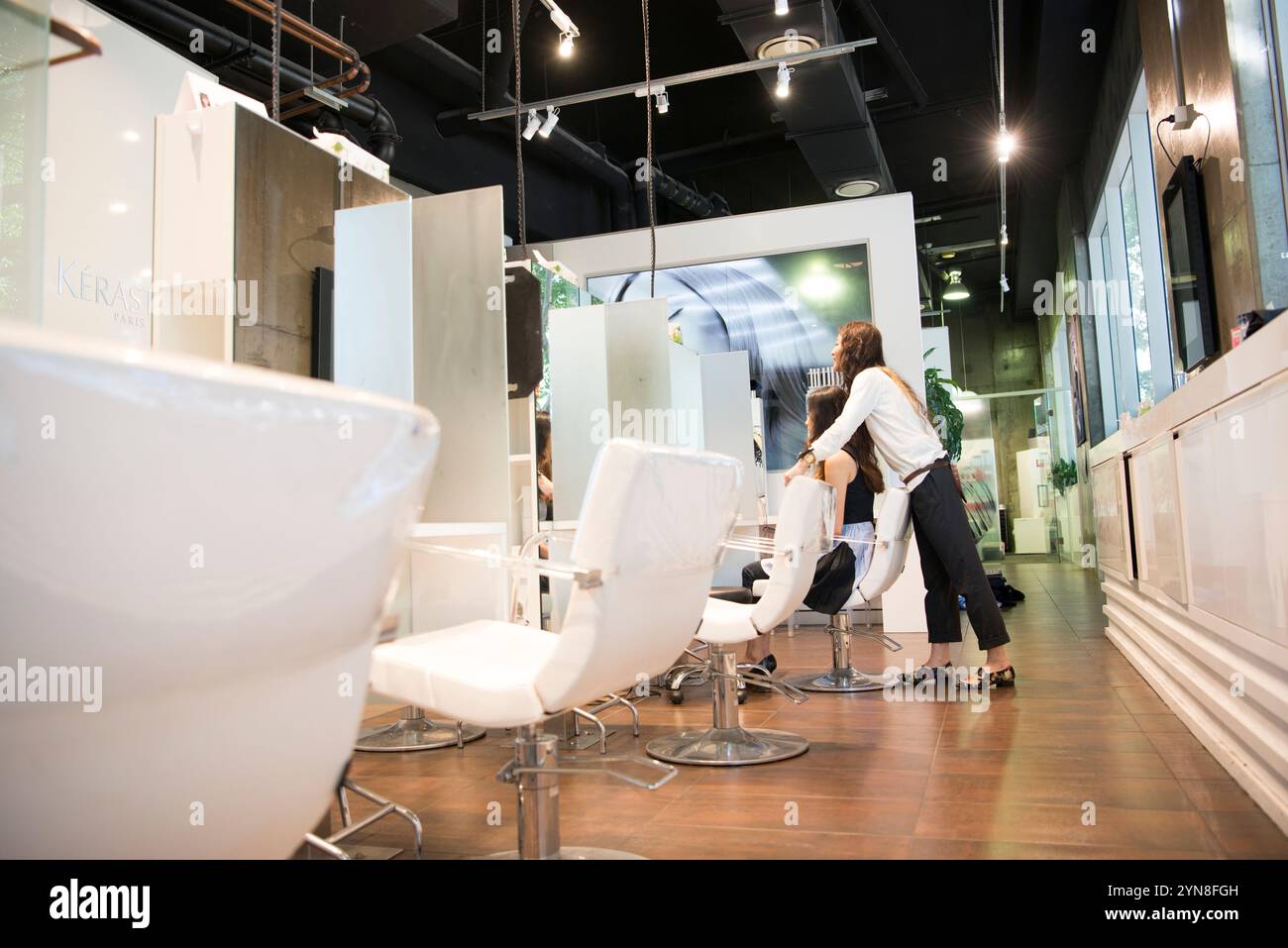 Woman having her hair done at a beauty salon Stock Photo - Alamy
