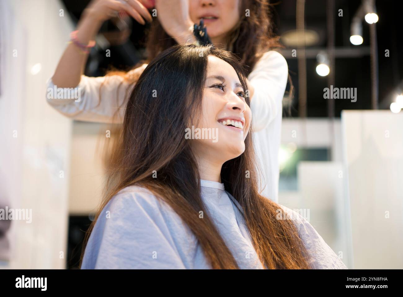 Woman having her hair cut at a beauty salon Stock Photo - Alamy