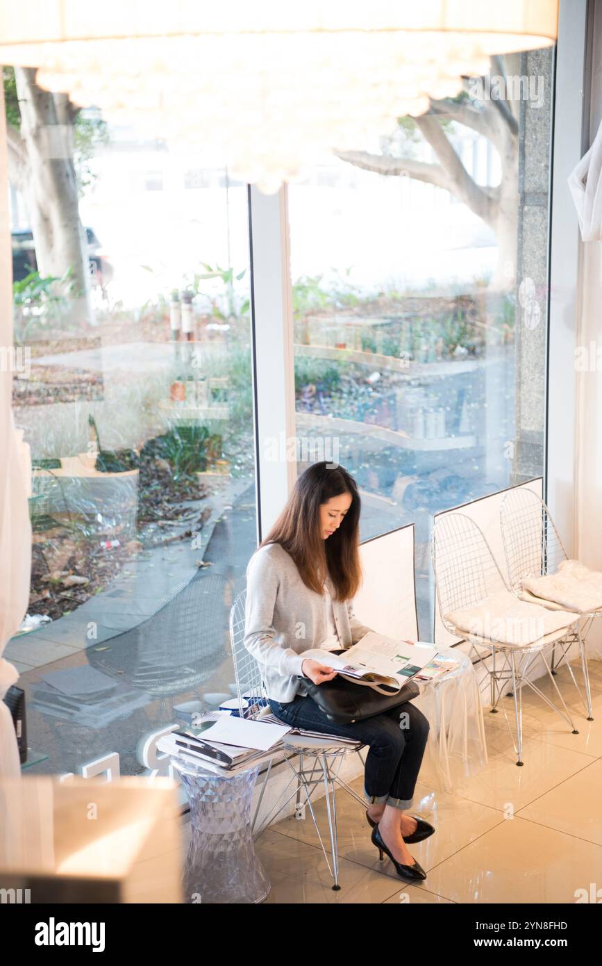 Woman waiting in salon hi-res stock photography and images - Alamy