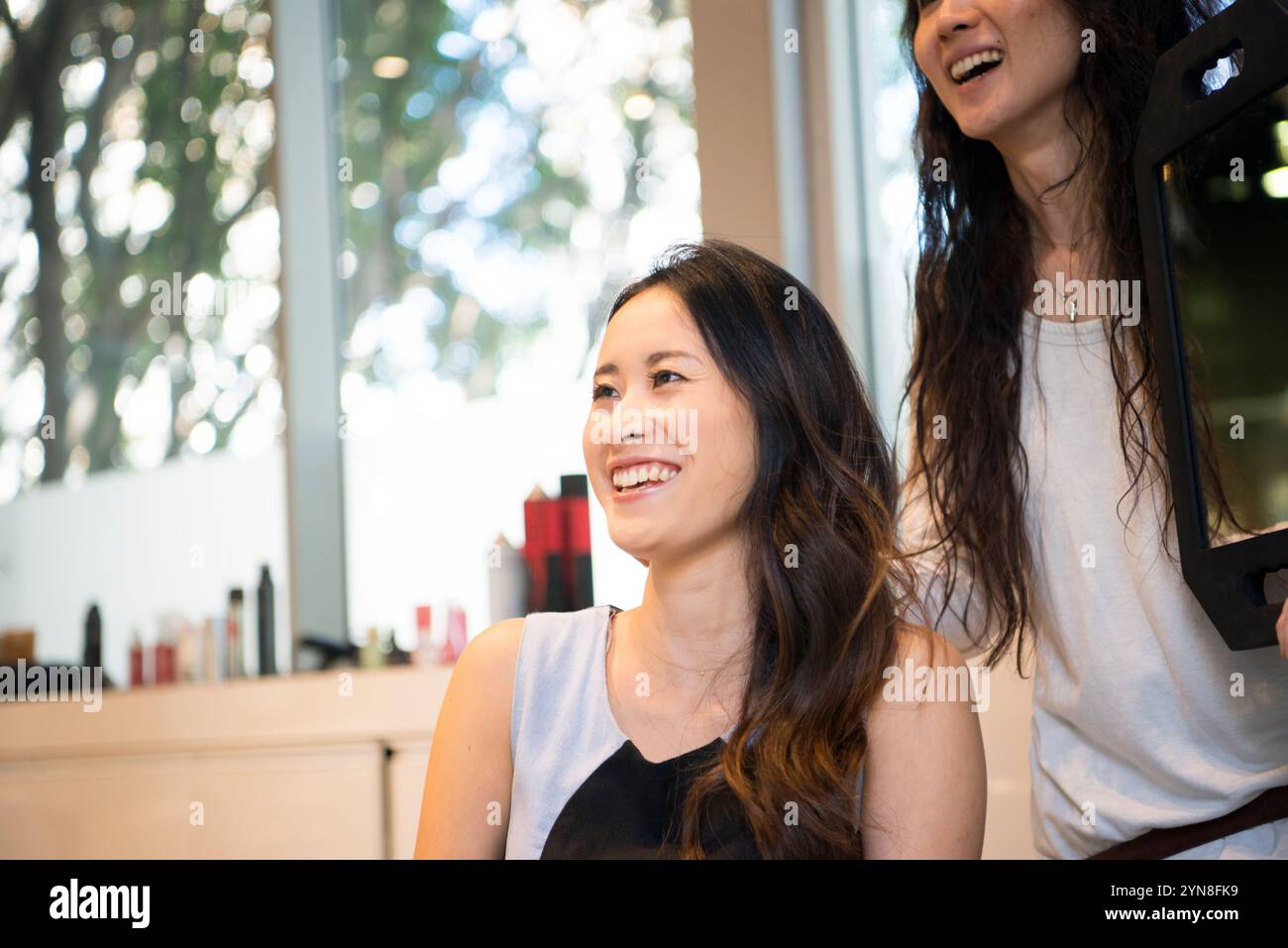 Woman having her hair done at a beauty salon Stock Photo - Alamy
