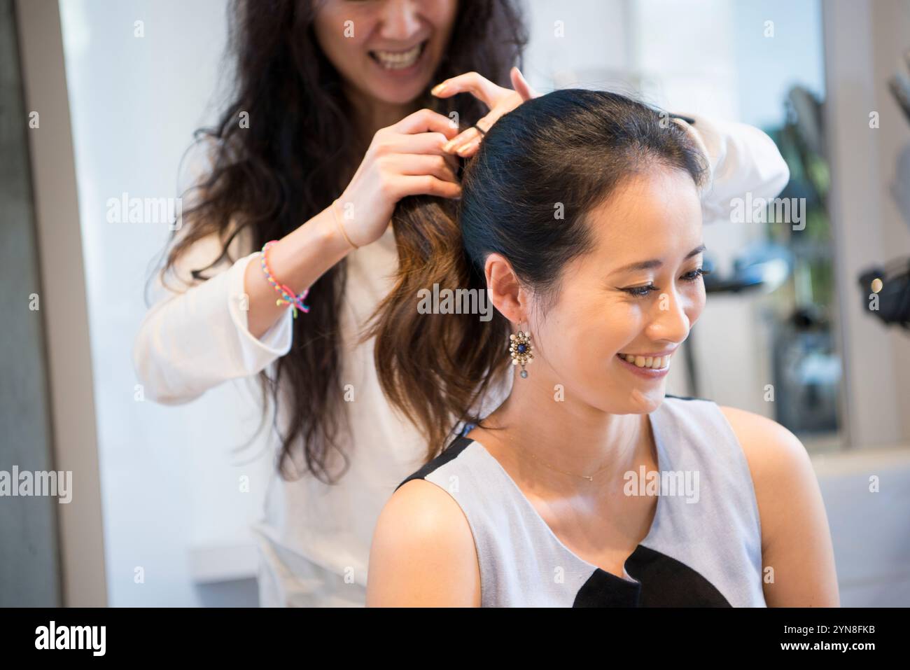 Woman having her hair done at a beauty salon Stock Photo - Alamy