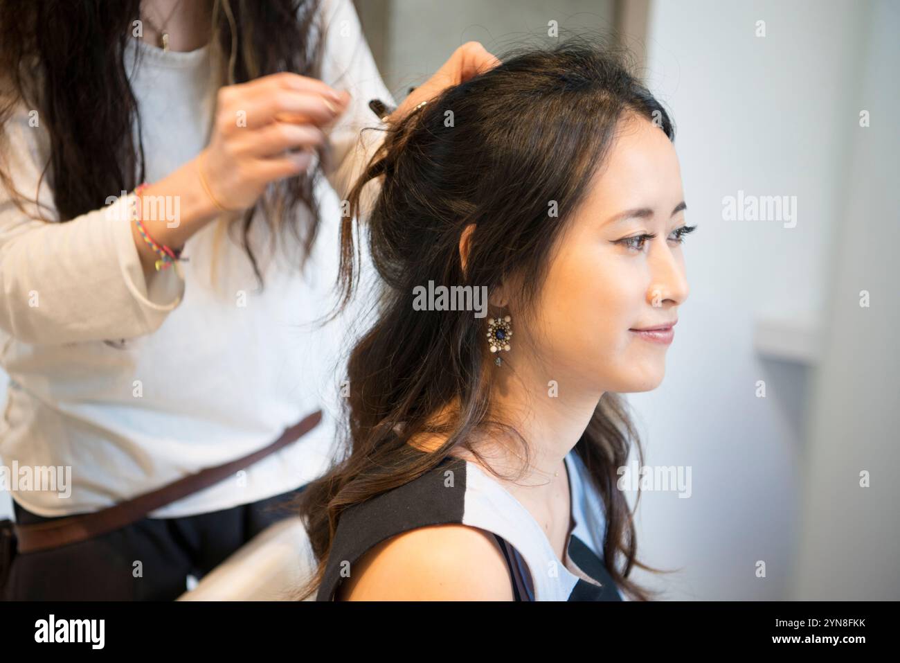 Woman having her hair done at a beauty salon Stock Photo - Alamy
