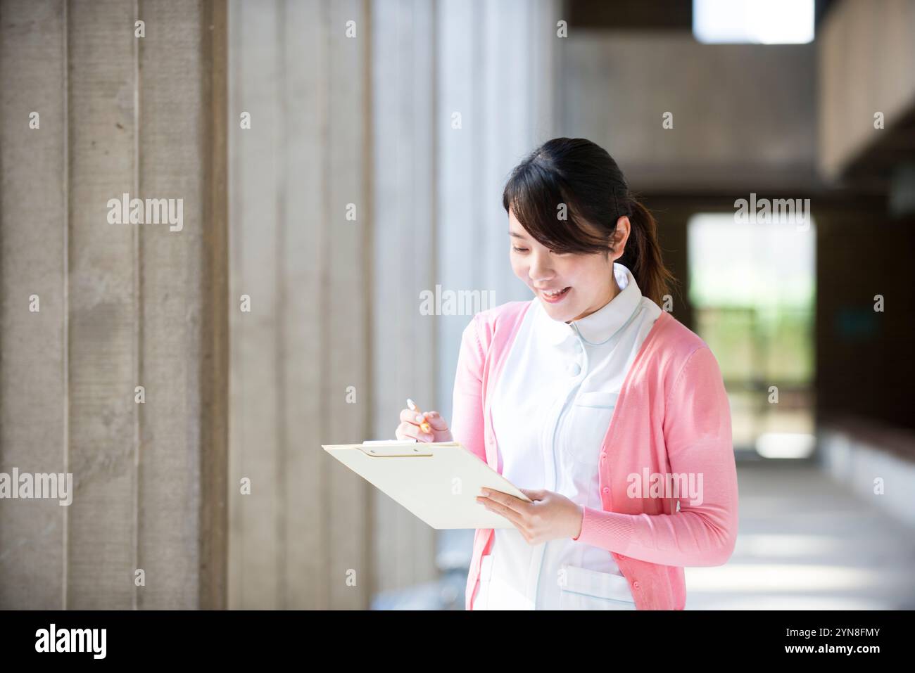 Woman writing on white board hi-res stock photography and images - Alamy