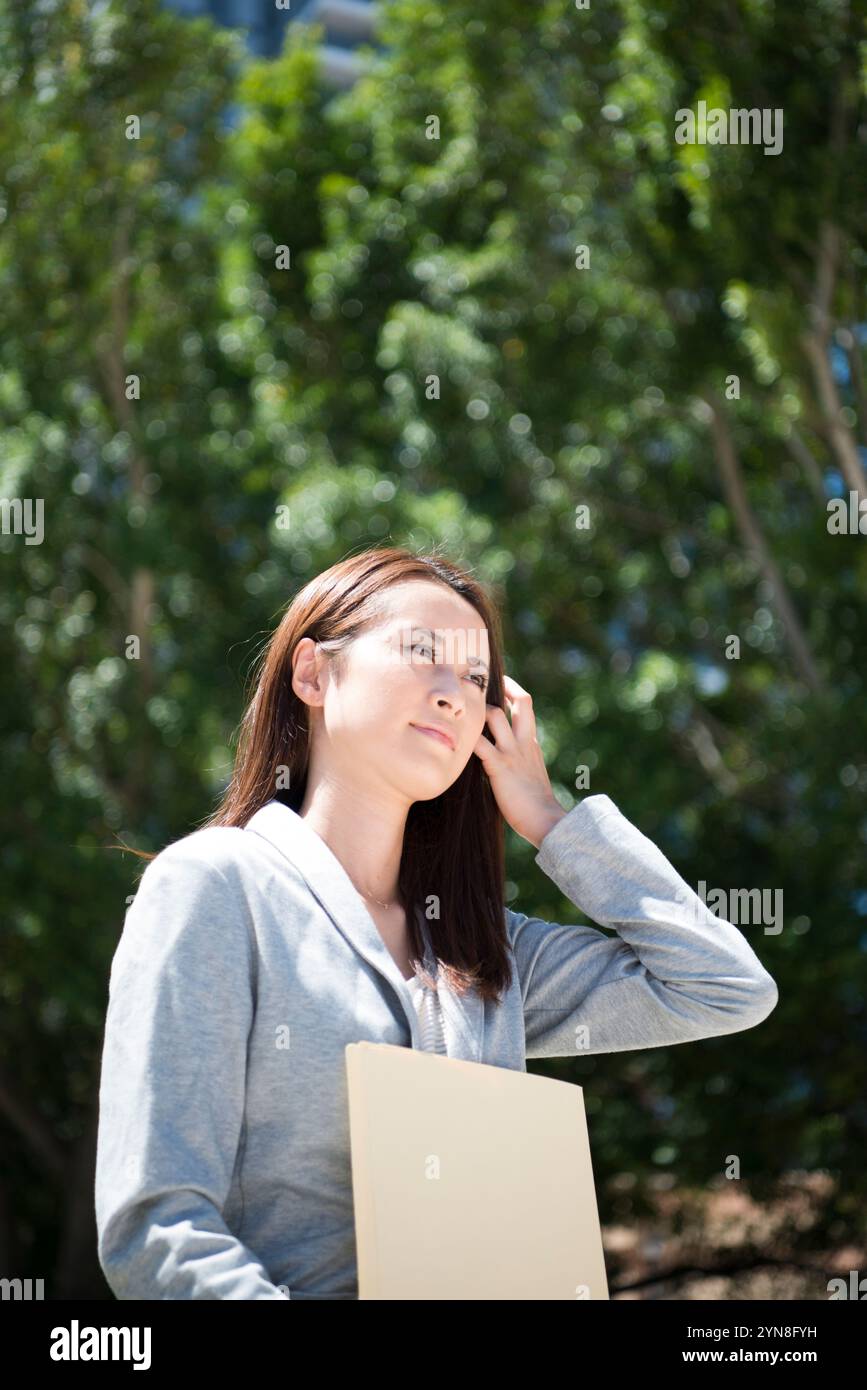 Working woman with file Stock Photo - Alamy