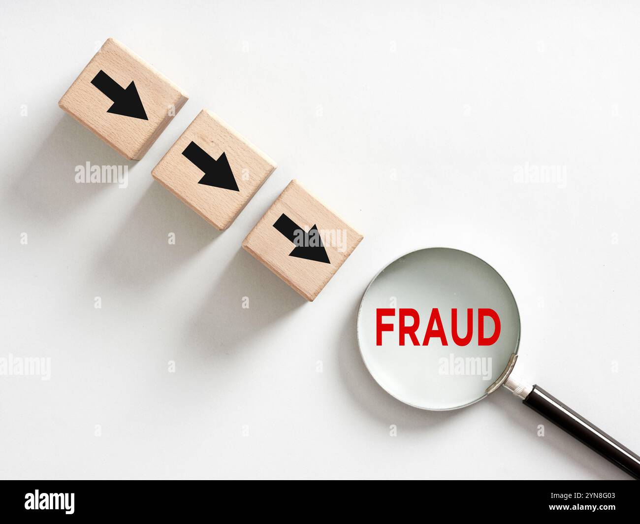 Fraud detection, revealing a fraud concepts. Magnifying glass showing ...