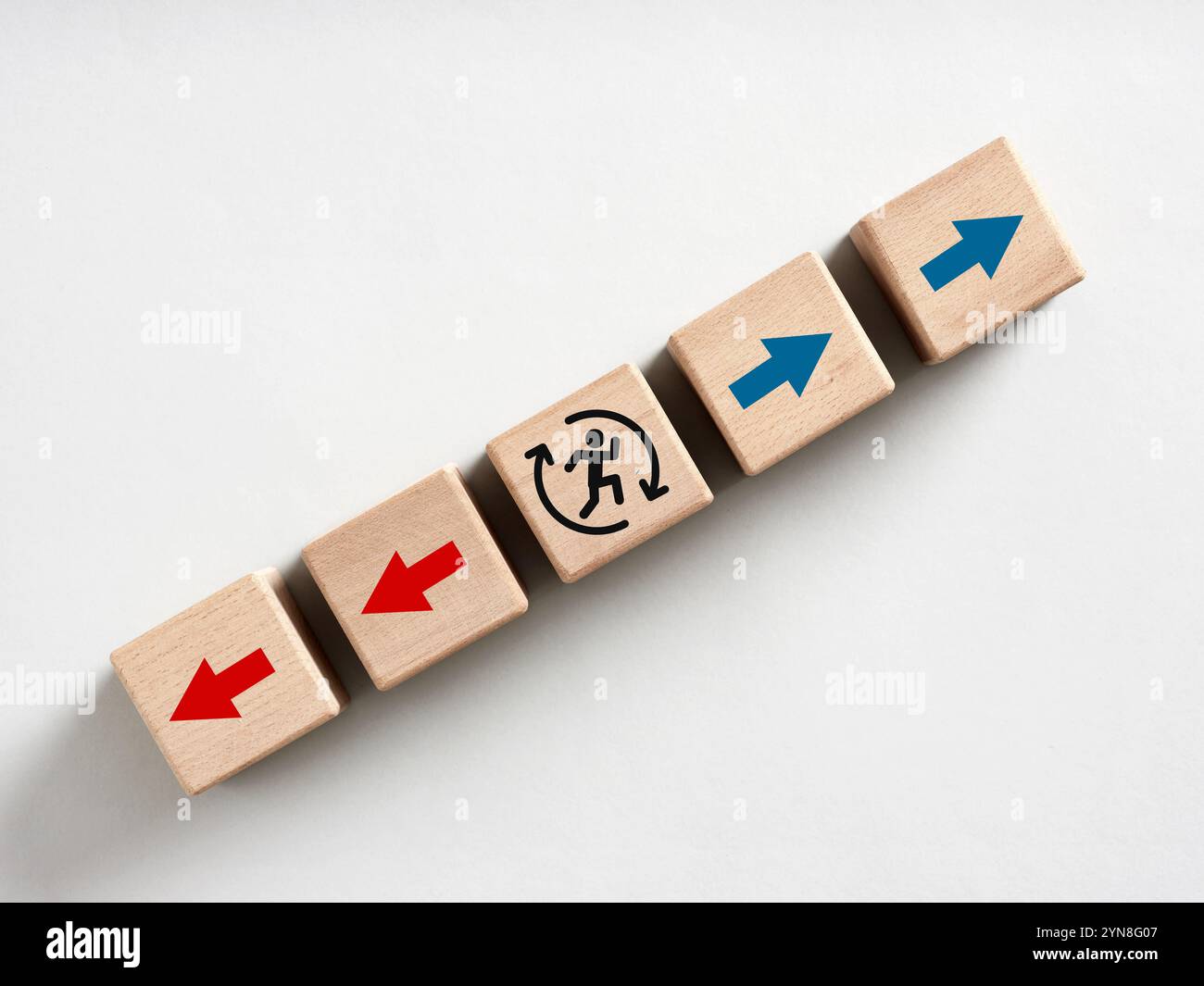 Decision between moving forward or backwards. Wooden cubes showing ...