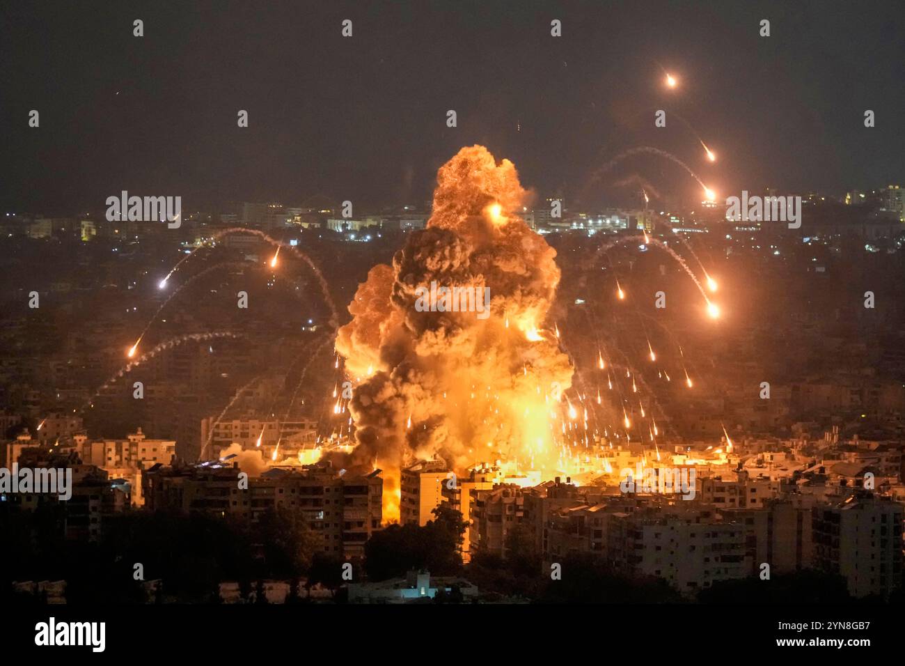 FILE - Flames and smoke rise from an Israeli airstrike in Dahiyeh ...
