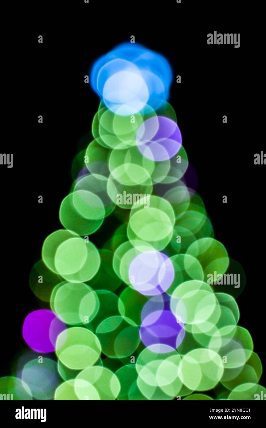 Christmas tree-shaped blur ball of light Stock Photo - Alamy