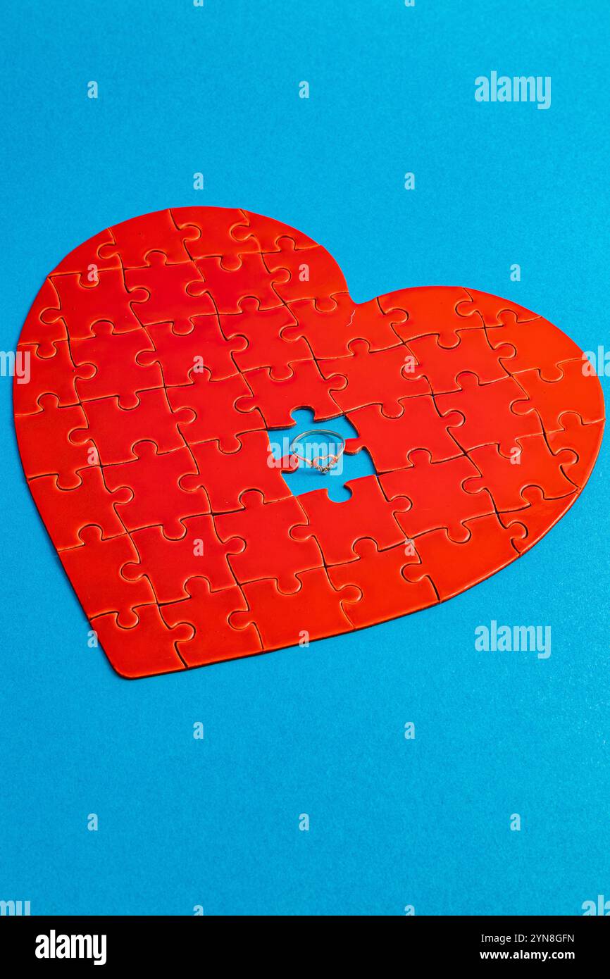 Love concept. Broken heart puzzle with wedding ring, missing puzzle ...