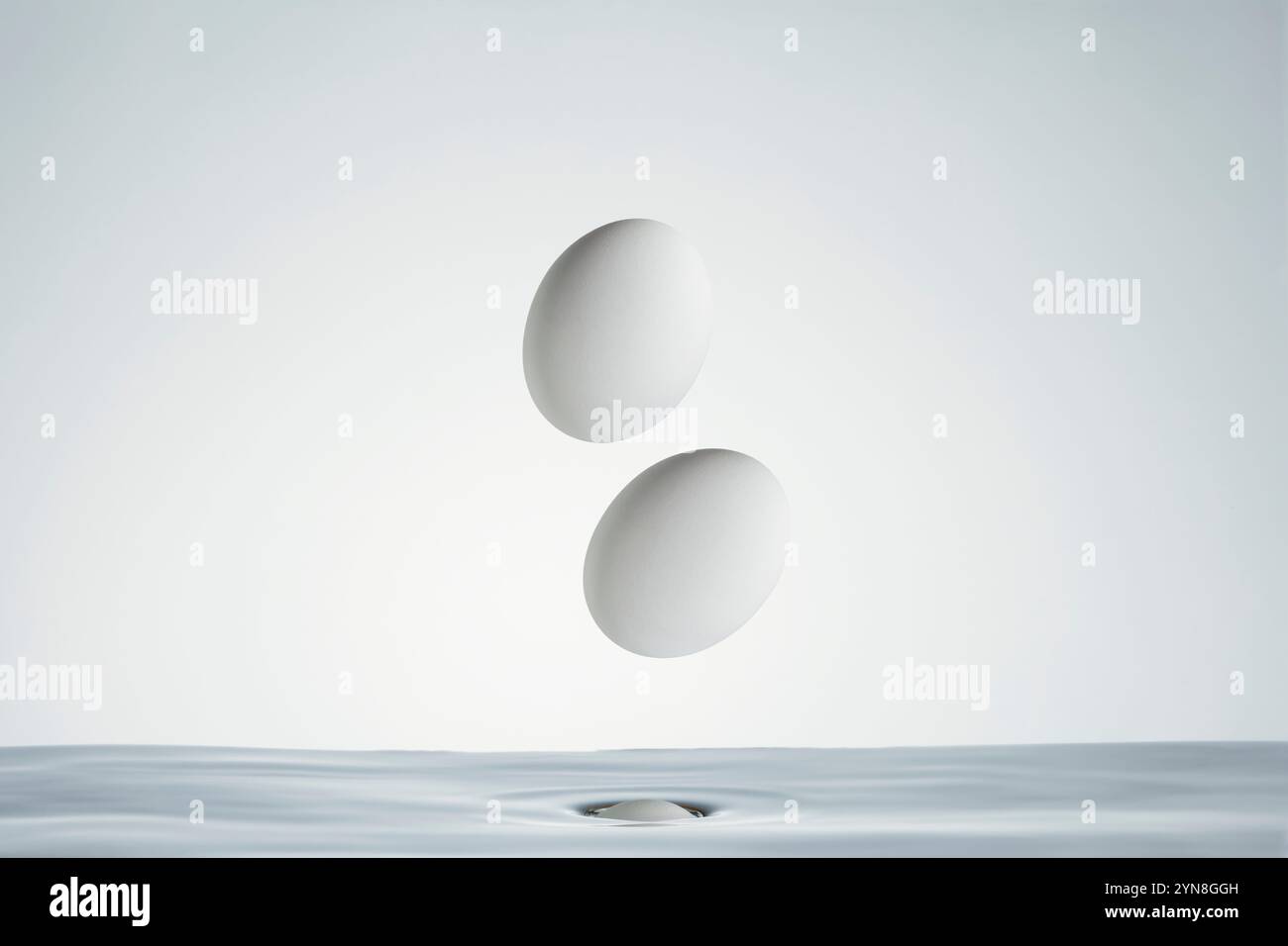 Egg in water Stock Photo - Alamy