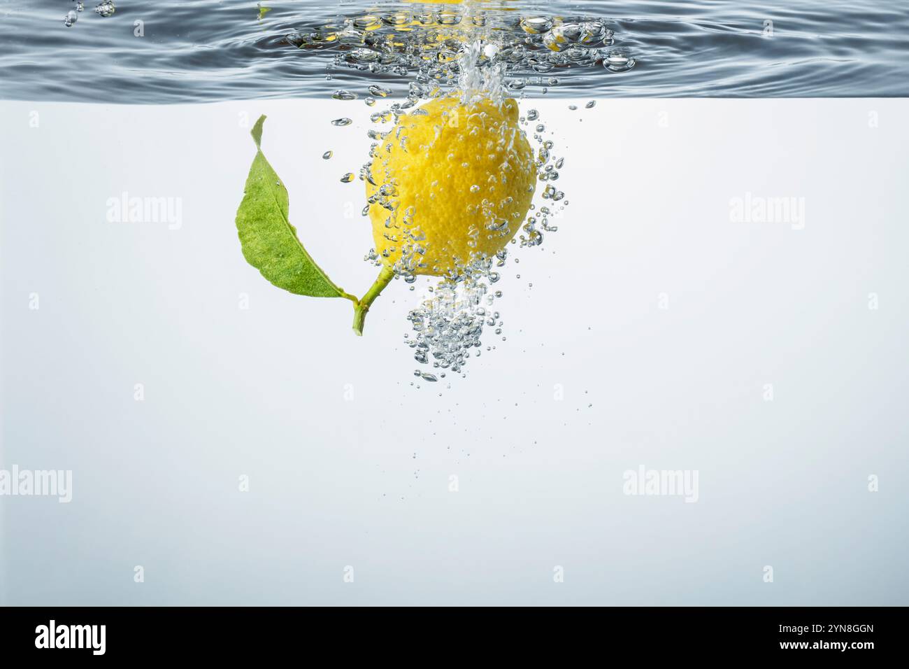 Lemon in water Stock Photo - Alamy