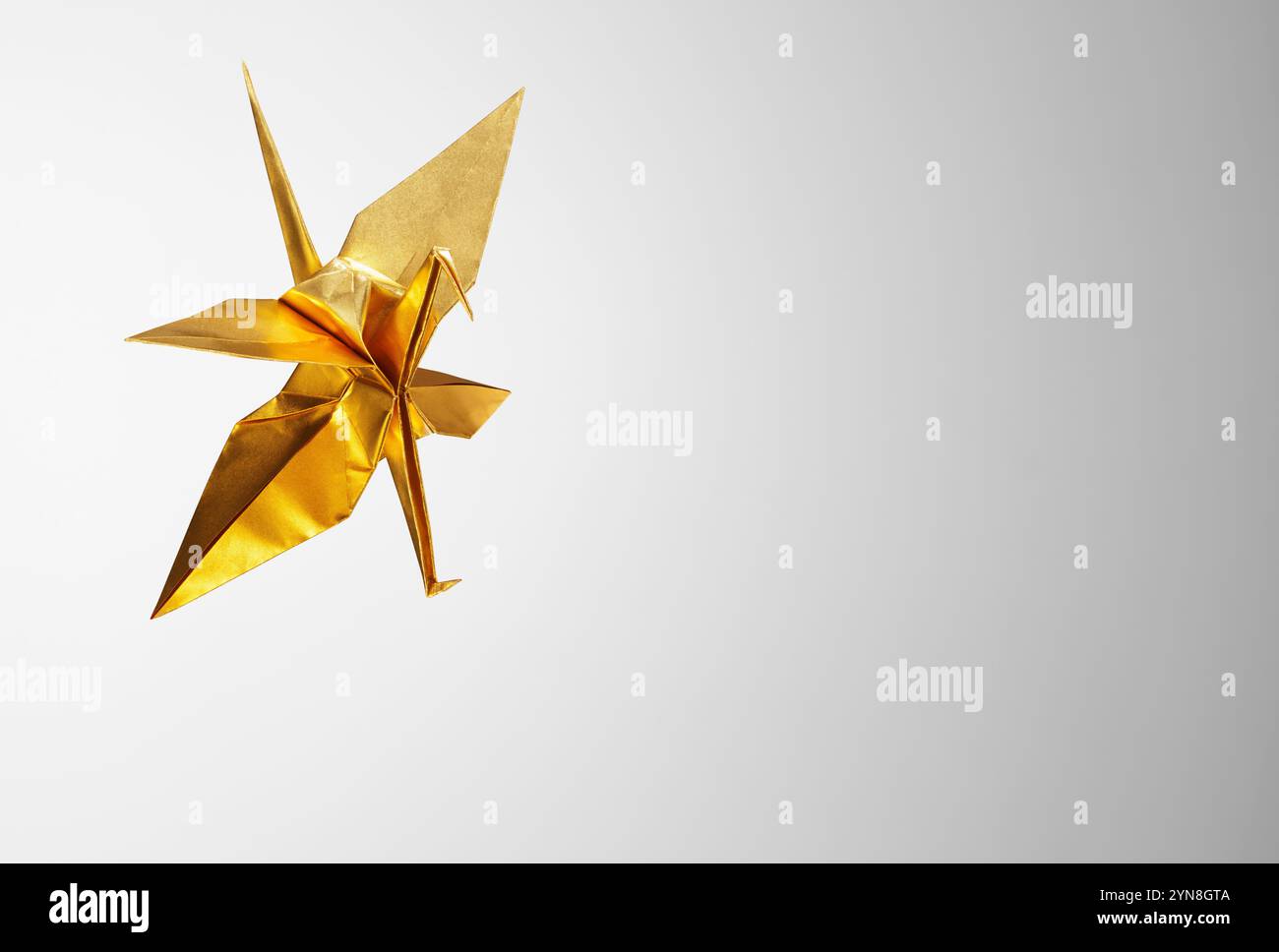 Gold folded paper cranes Stock Photo - Alamy