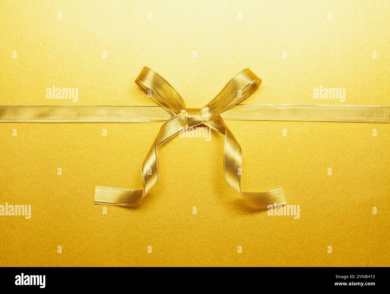 Gold ribbon bow Stock Photo - Alamy