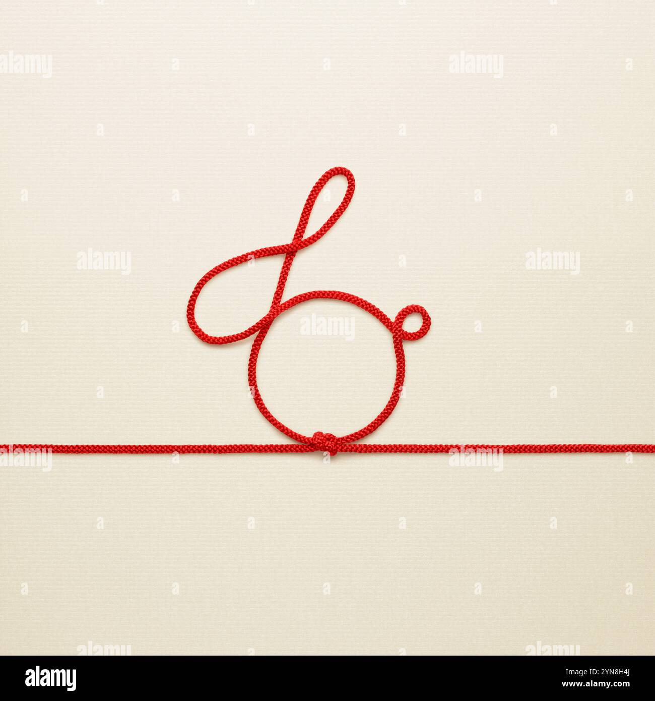 Image of a rabbit made with red string Stock Photo - Alamy