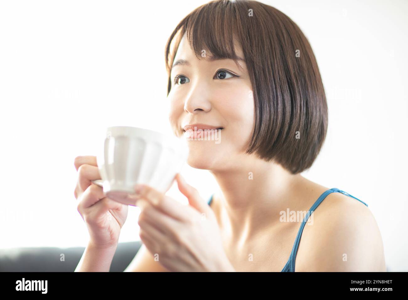 Smiling women with cups Stock Photo - Alamy