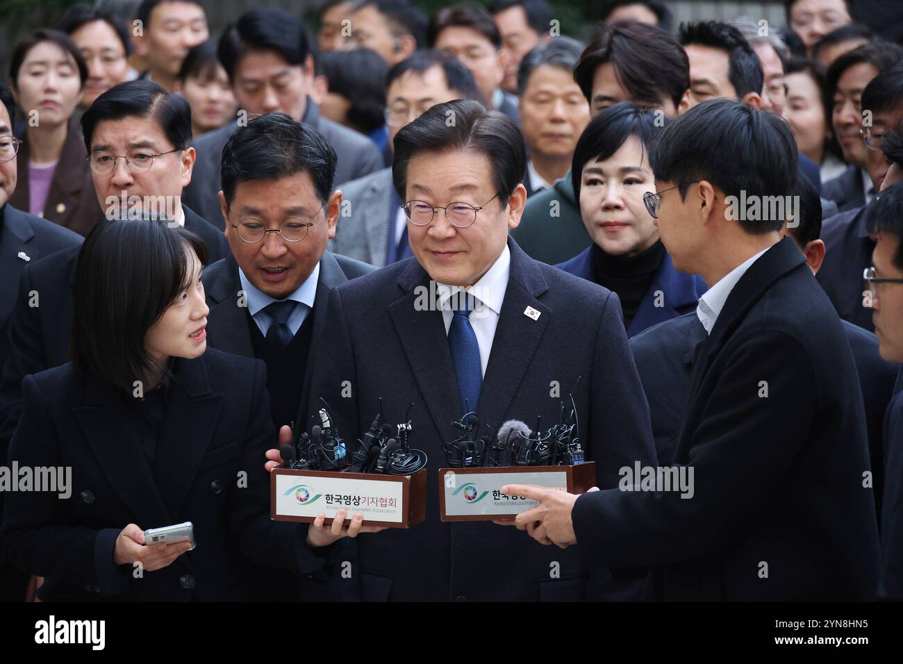 South Korea's main opposition Democratic Party leader Lee Jae-myung, center, arrives at a court ...