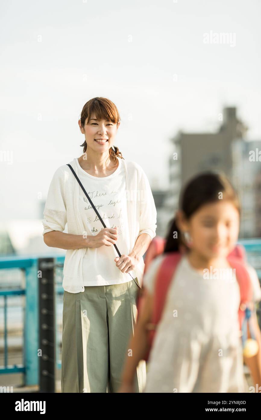 Woman watching over children hi-res stock photography and images - Alamy