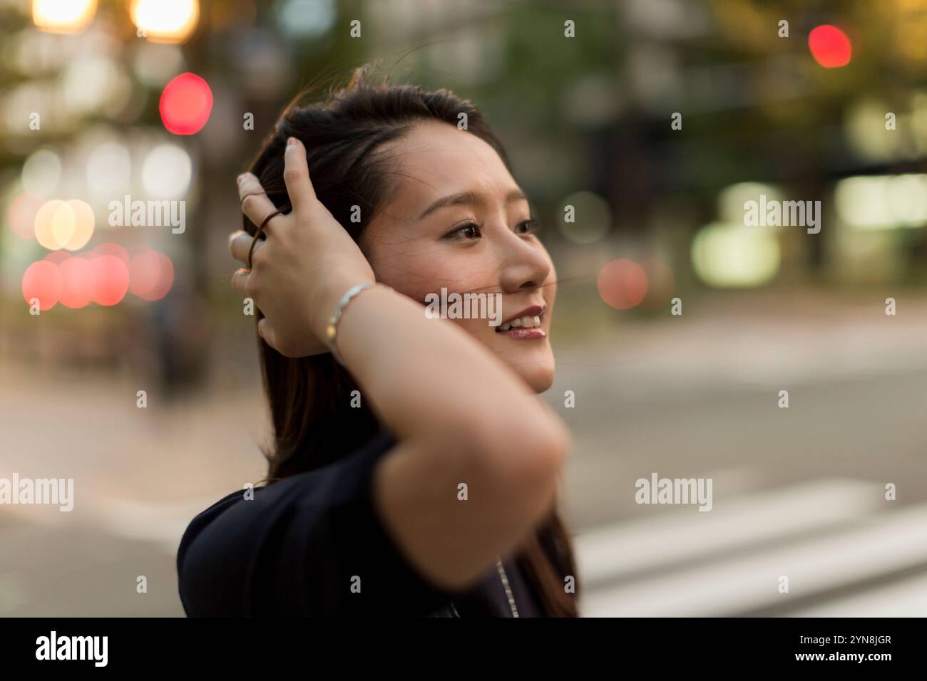Young woman scratching her hair Stock Photo - Alamy