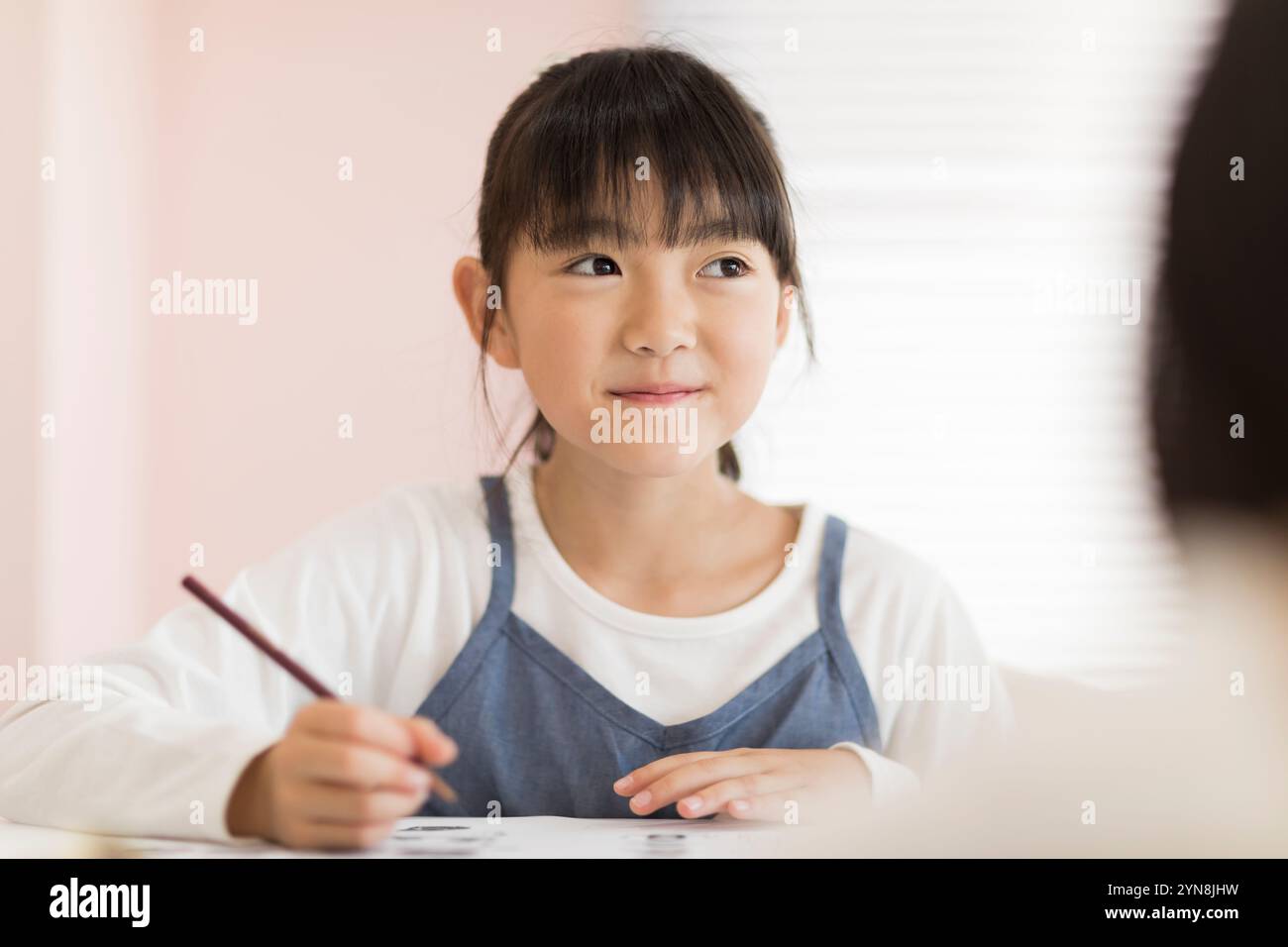 Girls studying in a classroom Stock Photo - Alamy