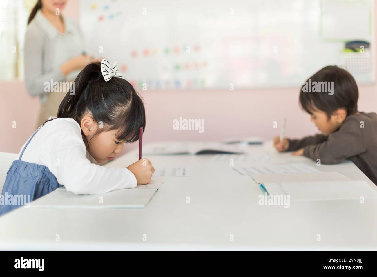 Children studying in the classroom Stock Photo - Alamy