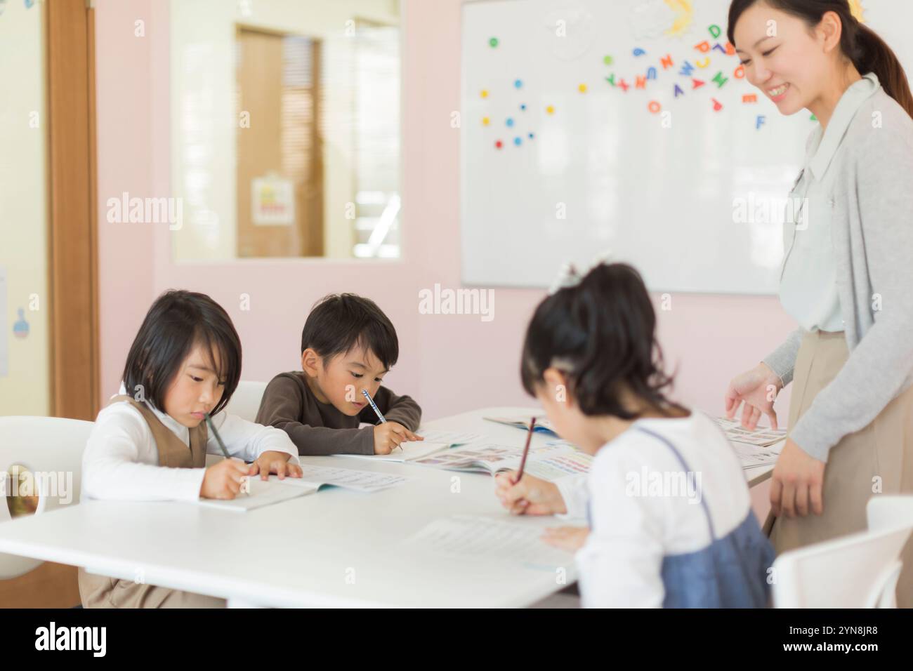 Children studying in the classroom Stock Photo - Alamy
