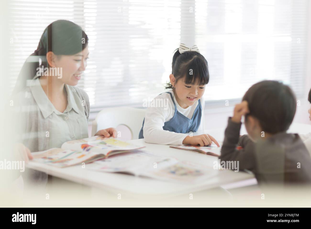 Children taking a class in a classroom Stock Photo - Alamy