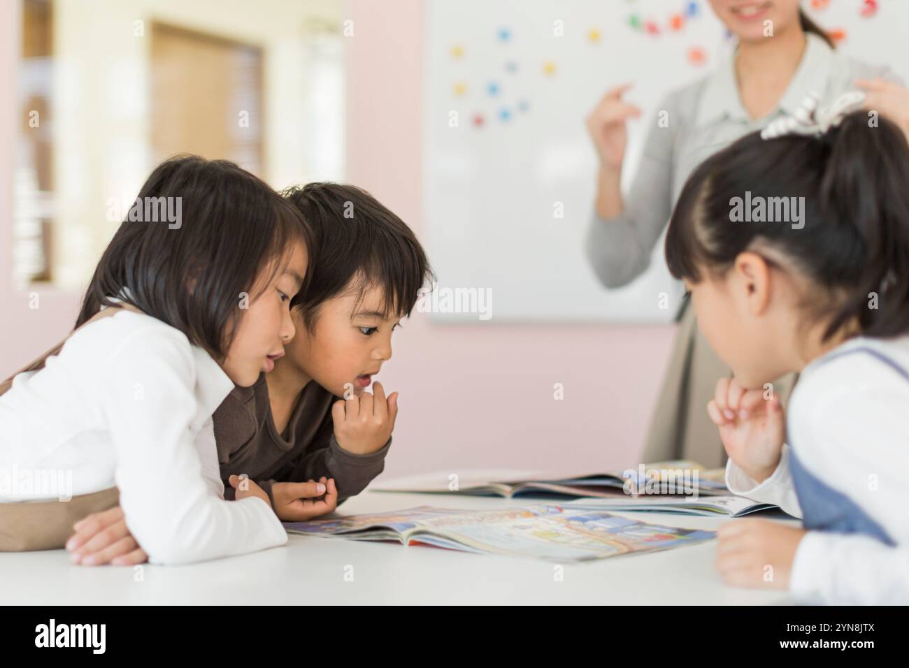Children taking a class in a classroom Stock Photo - Alamy