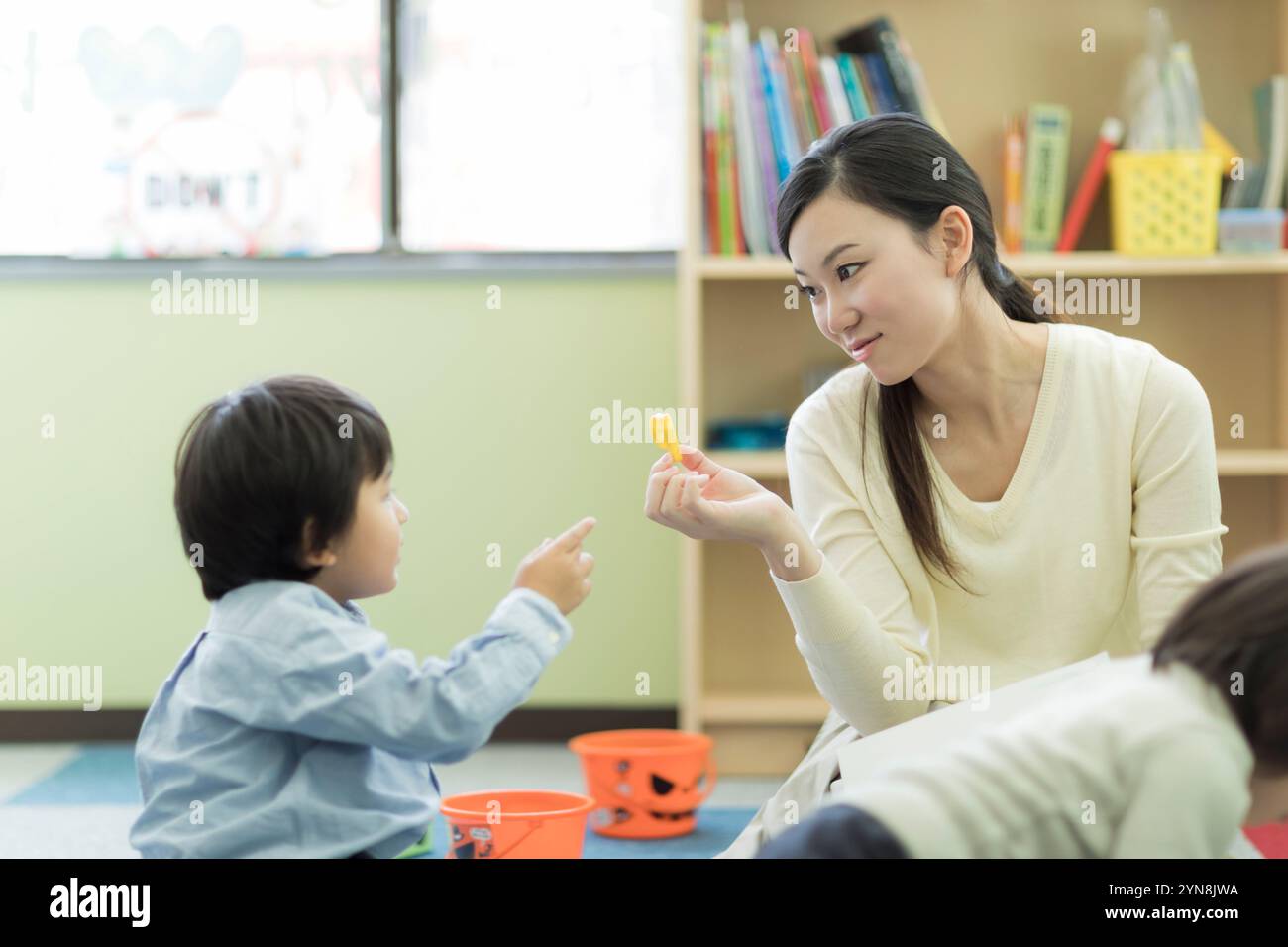 Boys learning in an early childhood classroom Stock Photo - Alamy