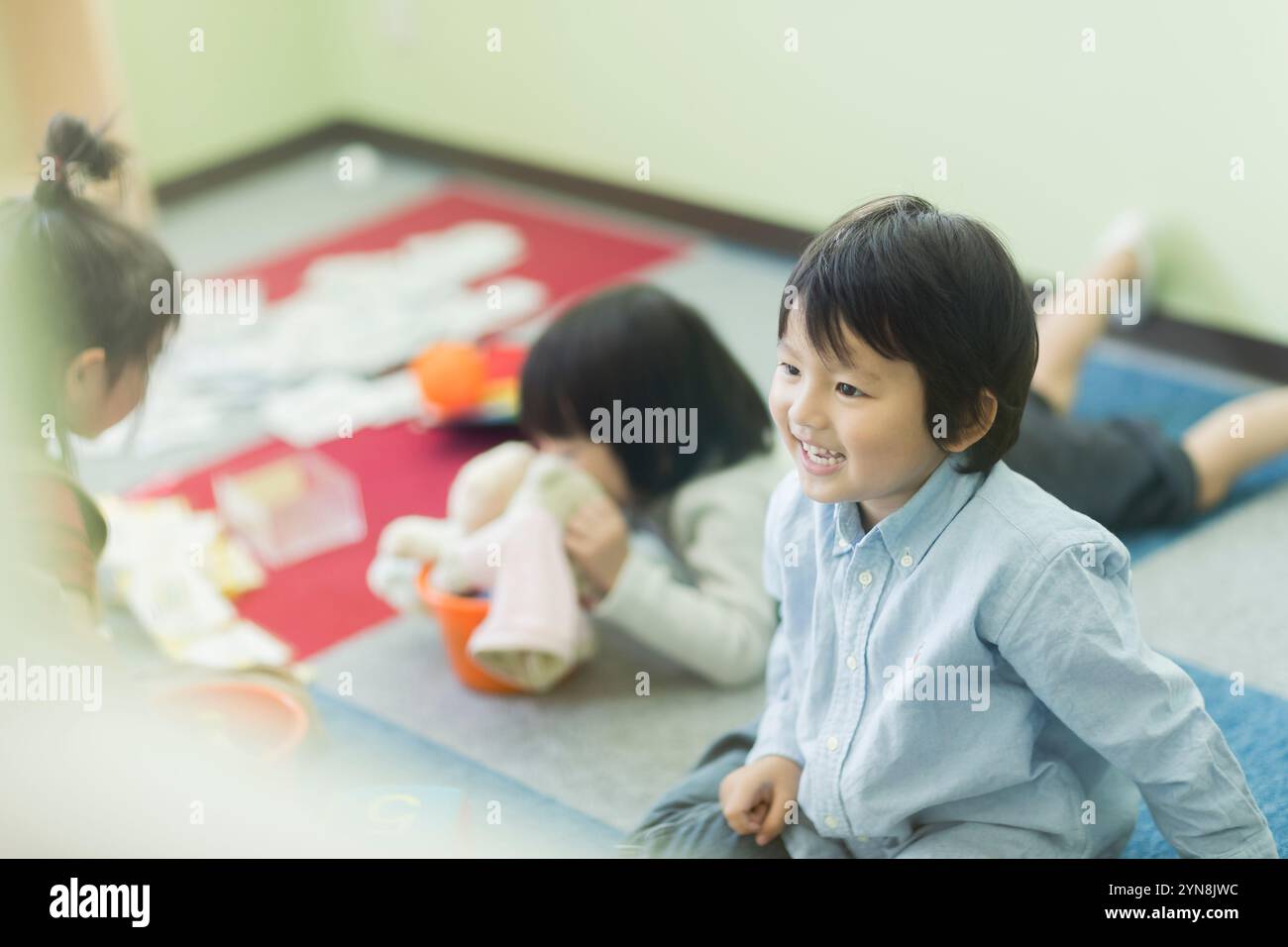 Children learning in toddler classroom Stock Photo - Alamy