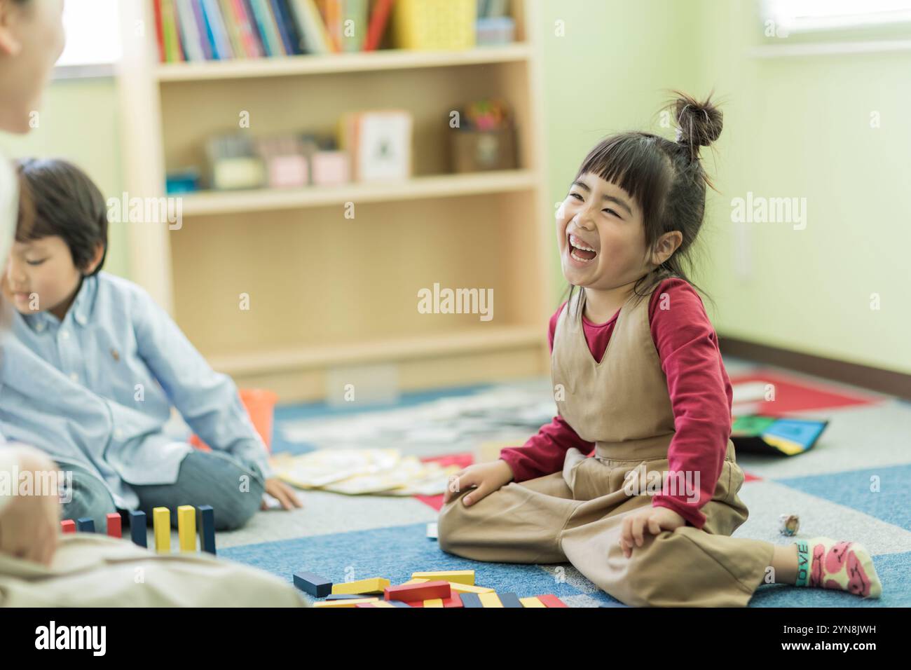 Children learning in toddler classroom Stock Photo - Alamy