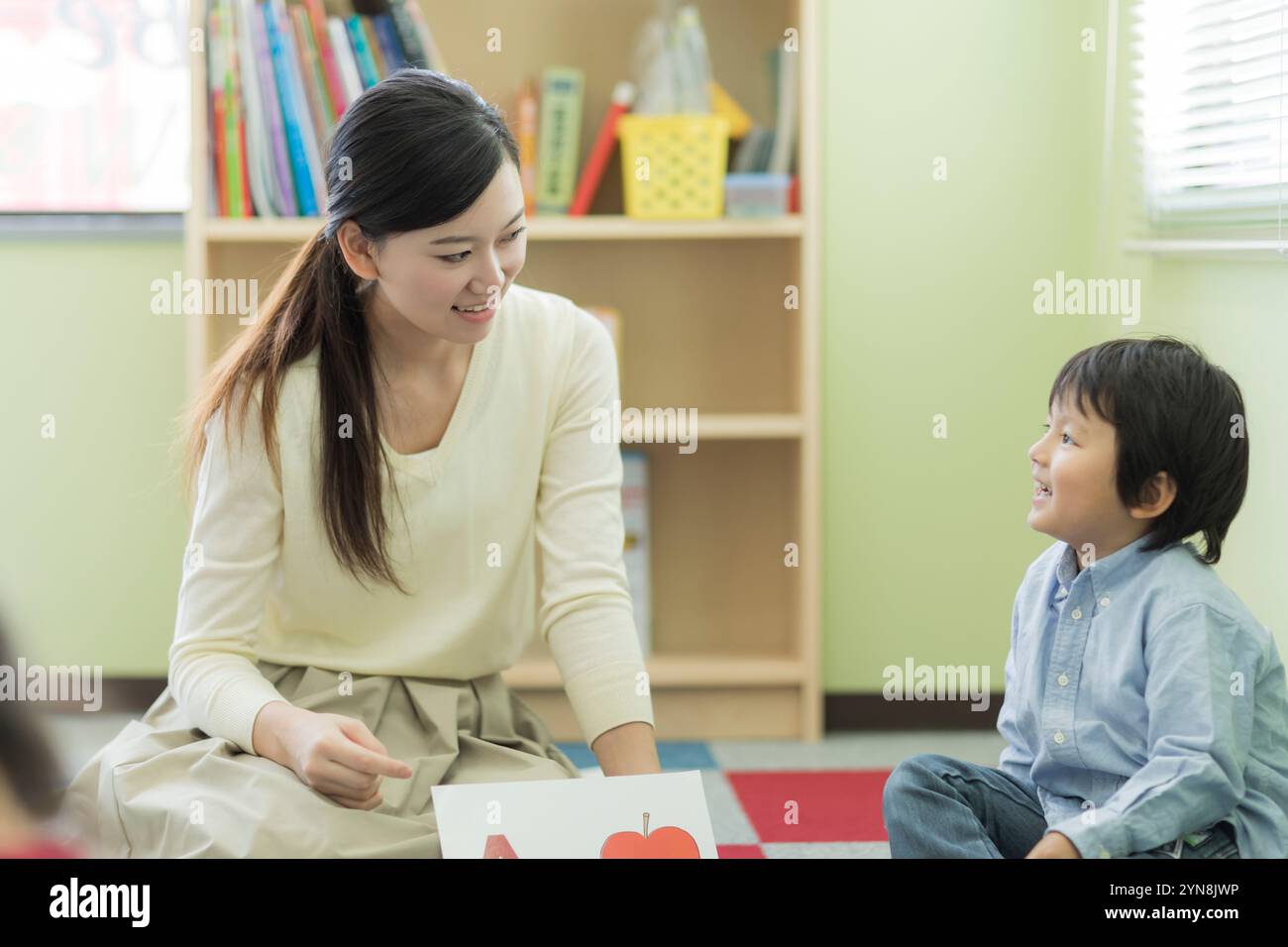 Boys learning in an early childhood classroom Stock Photo - Alamy