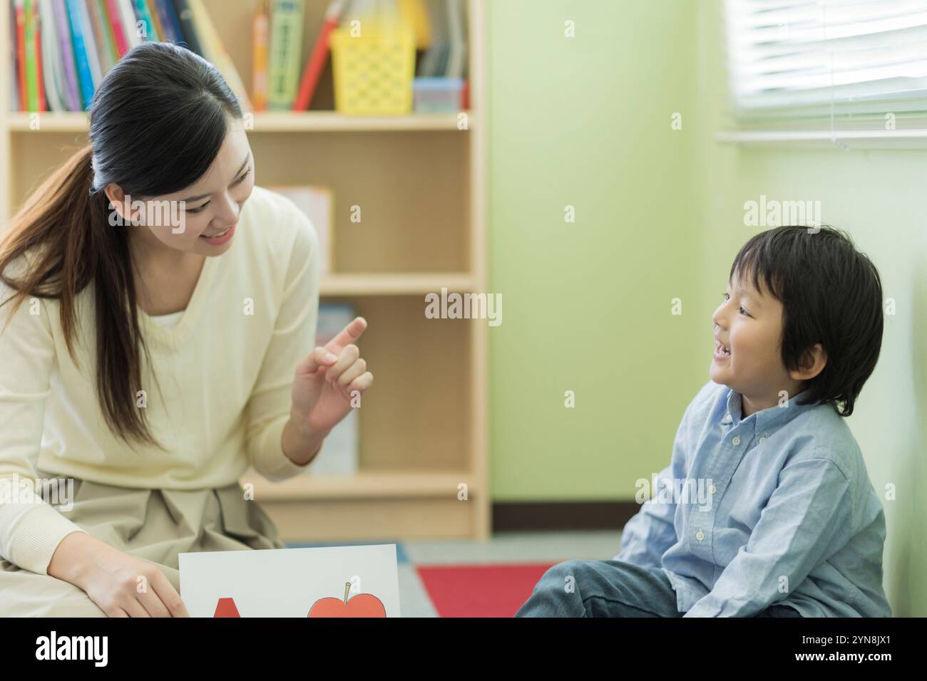 Boys learning in an early childhood classroom Stock Photo - Alamy