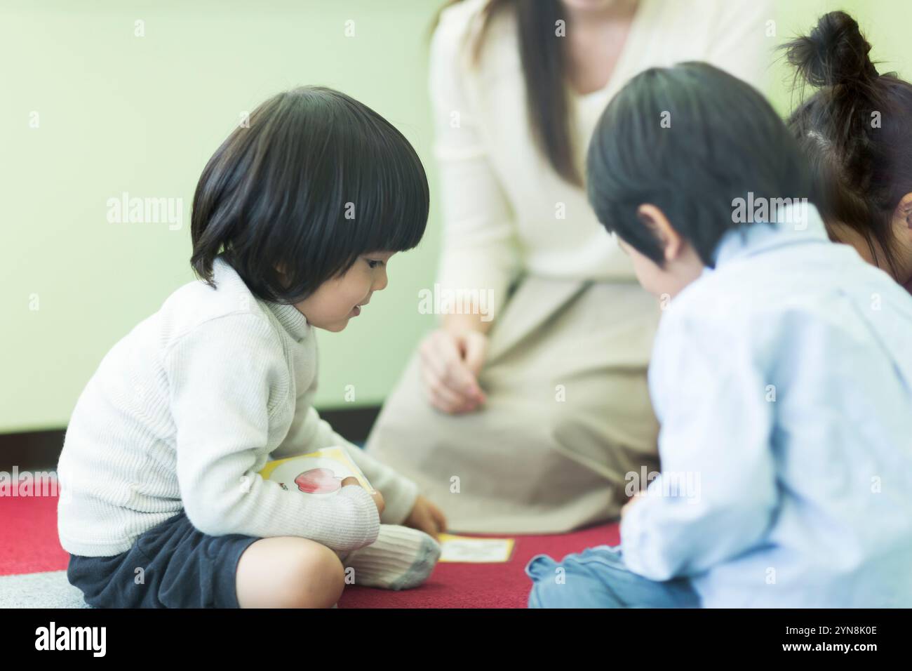 Children learning in toddler classroom Stock Photo - Alamy
