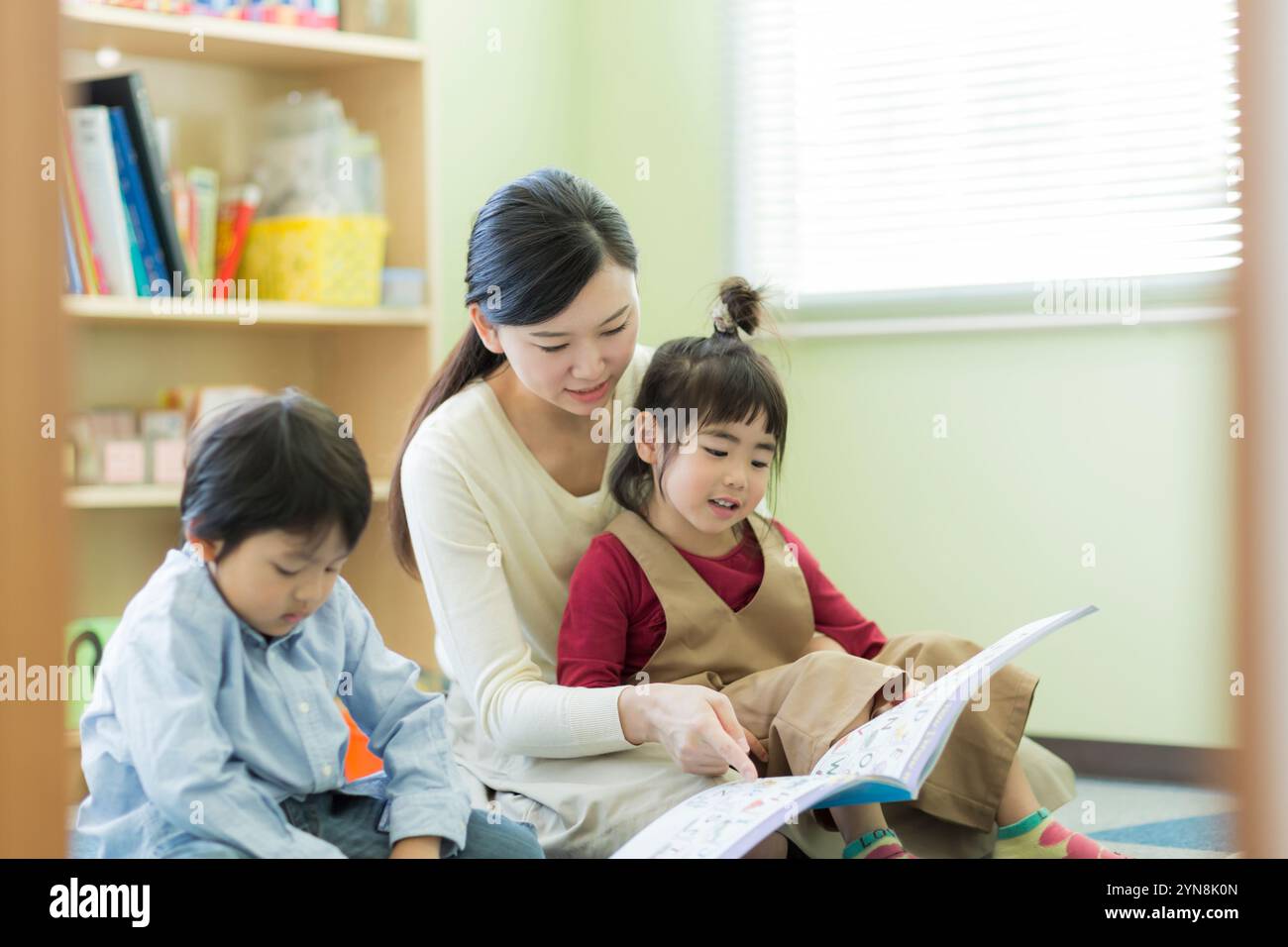 Children learning in toddler classroom Stock Photo - Alamy