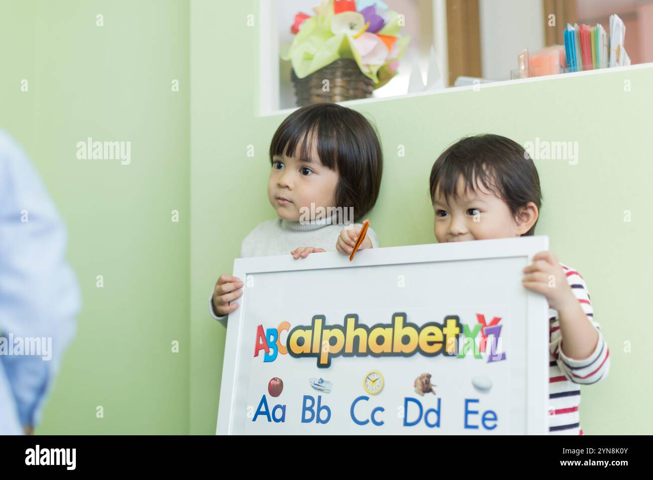 Children with alphabet panels Stock Photo - Alamy
