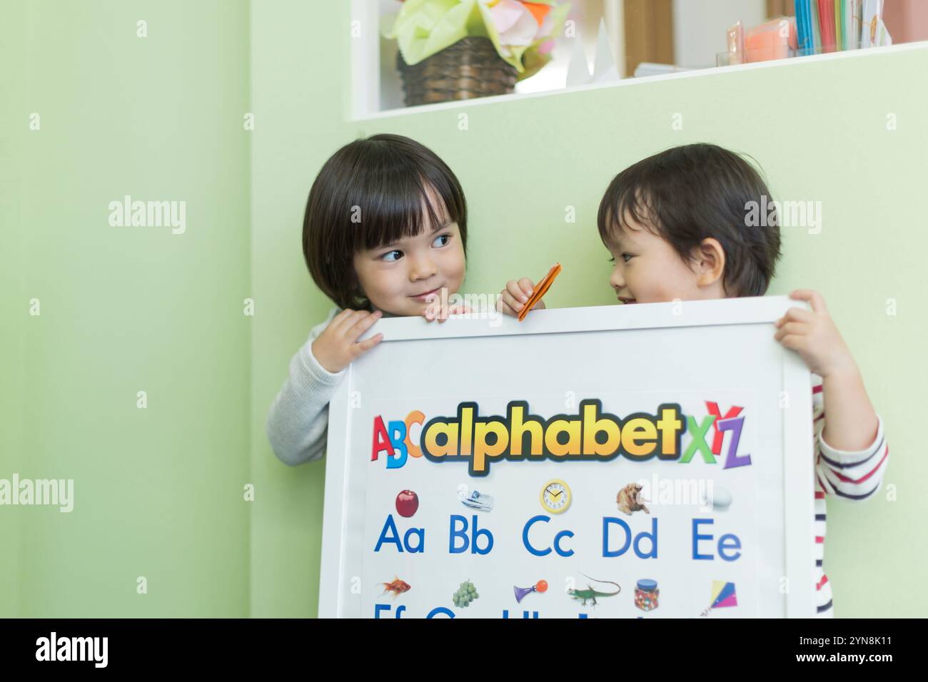 Children with alphabet panels Stock Photo - Alamy