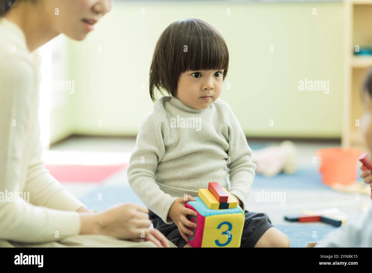 Boys learning in an early childhood classroom Stock Photo - Alamy