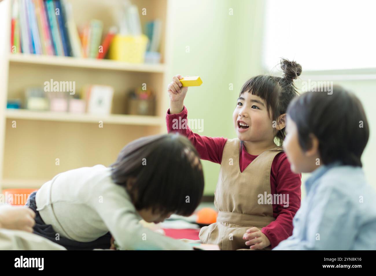 Children learning in toddler classroom Stock Photo - Alamy