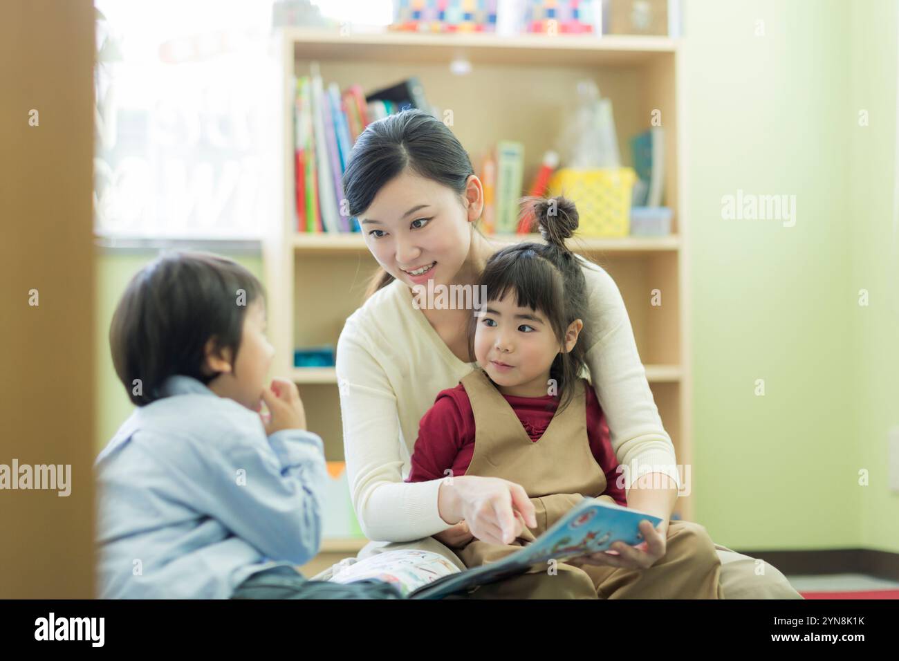 Children learning in toddler classroom Stock Photo - Alamy