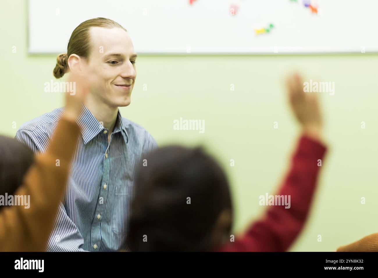 Teachers and children giving an English lesson Stock Photo - Alamy