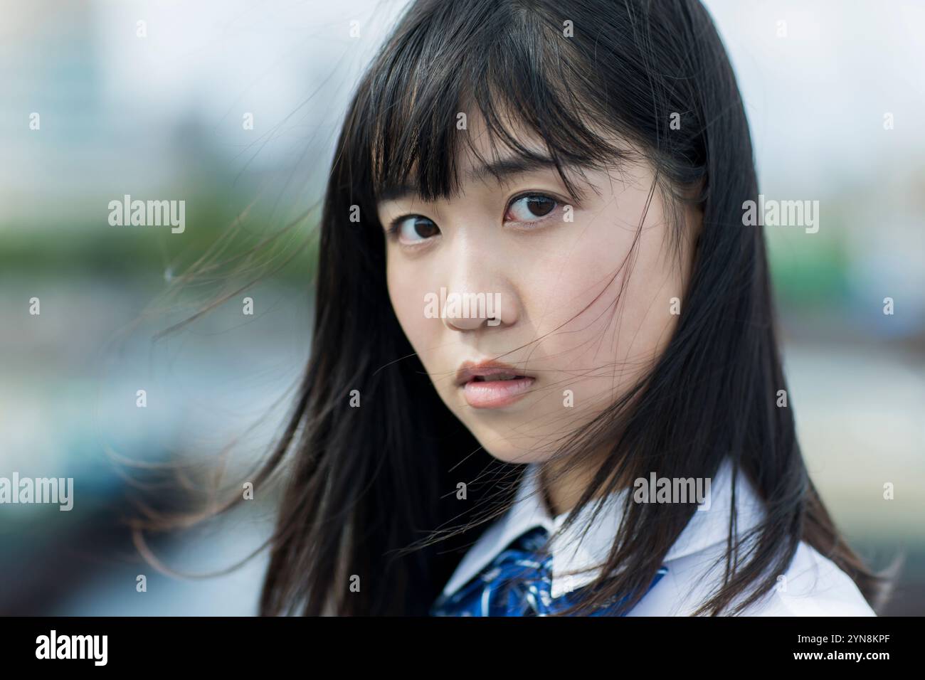 Female student with a serious expression Stock Photo - Alamy