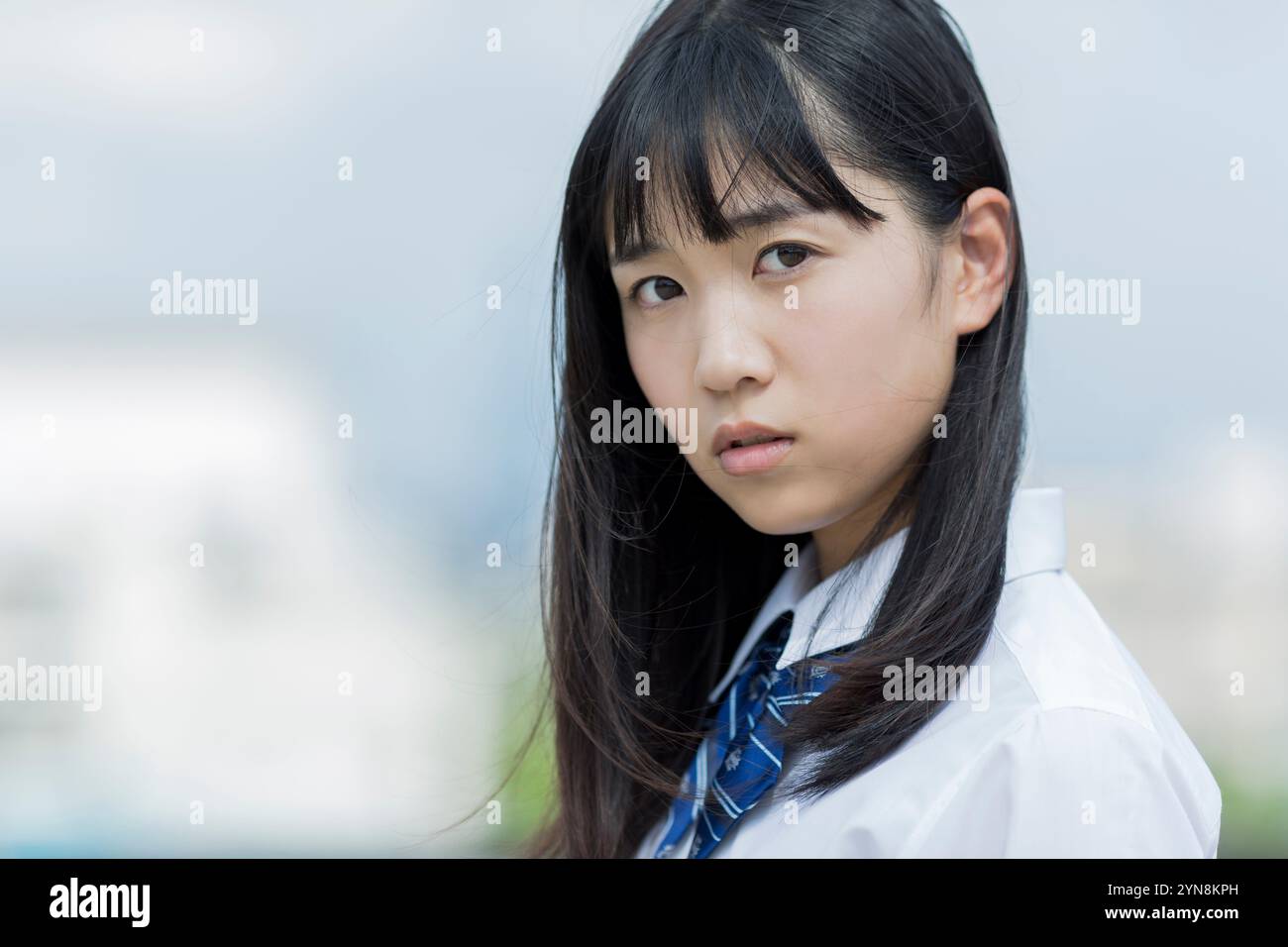 Female student with a serious expression Stock Photo - Alamy