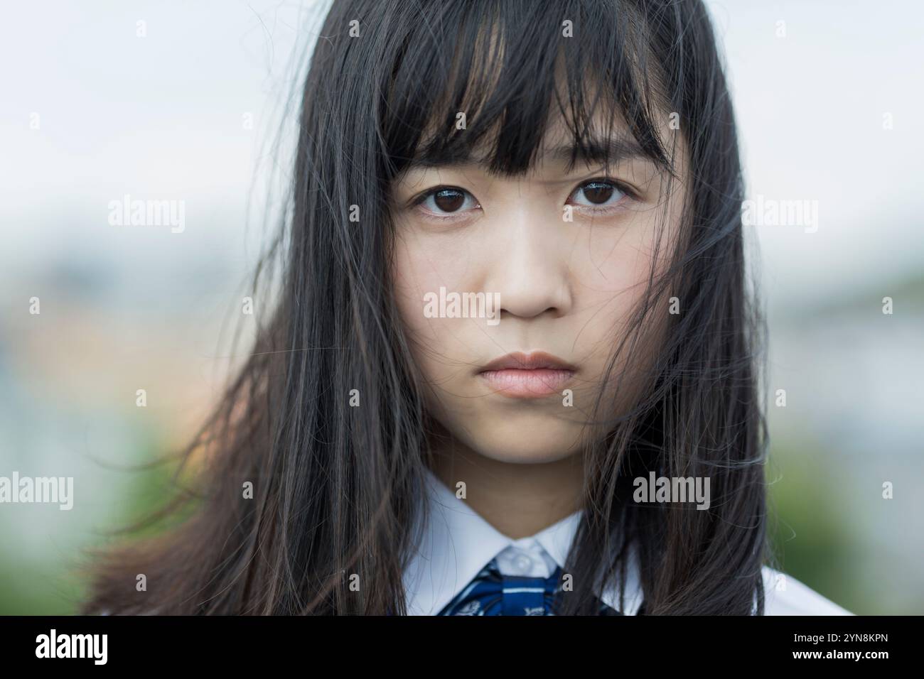 Female student with a serious expression Stock Photo - Alamy