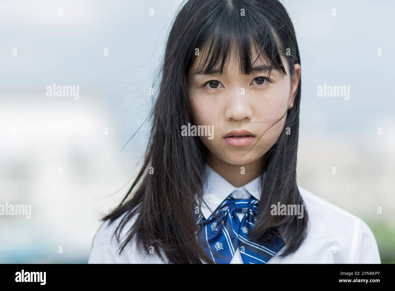 Female student with a serious expression Stock Photo - Alamy