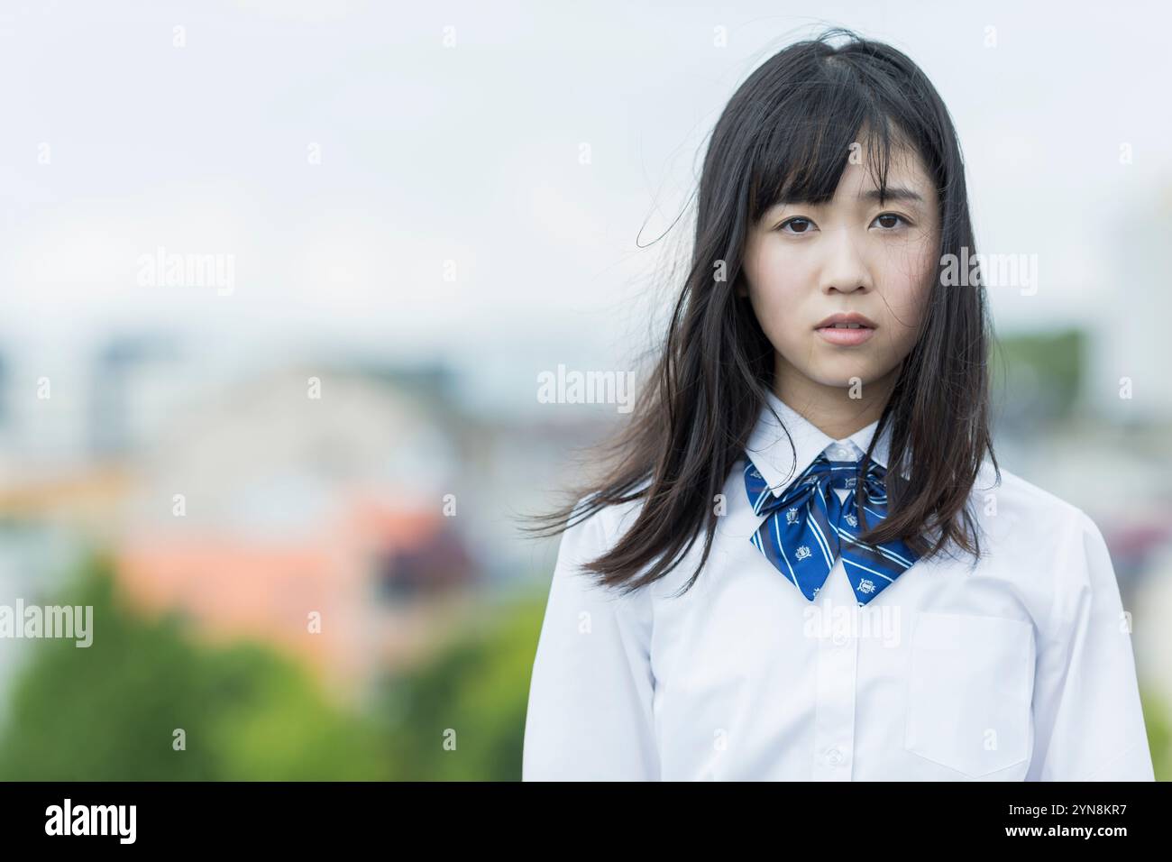 Female student with a serious expression Stock Photo - Alamy