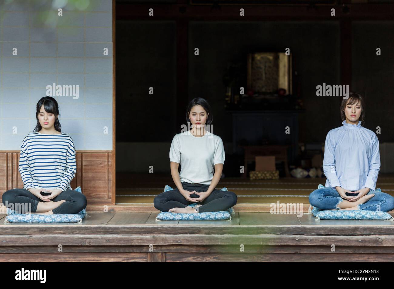Group three people doing meditation hi-res stock photography and images ...