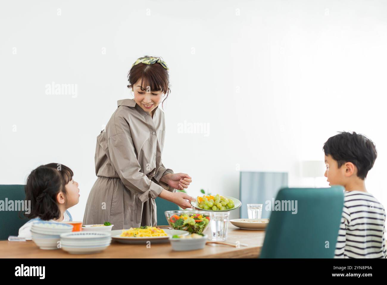 Parent and child preparing meal Stock Photo - Alamy