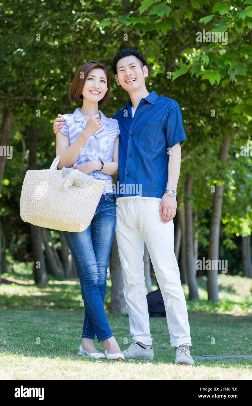 Couple in their 20s and 30s hugging each other on the shoulder in a ...