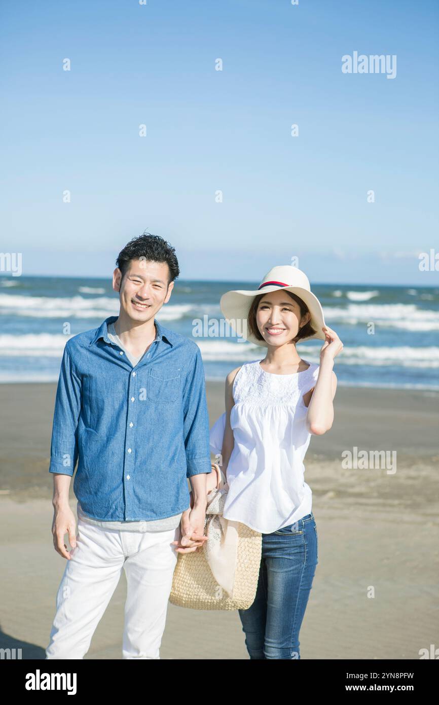 Couple in their 20s and 30s spending time at the sea Stock Photo - Alamy