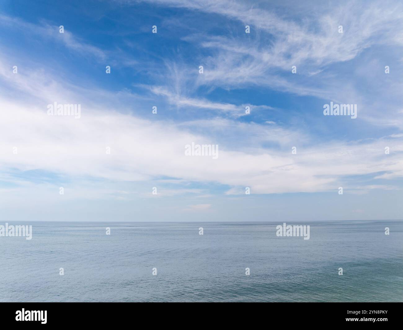 Aerial view of a blue sea surface water texture background and sun ...